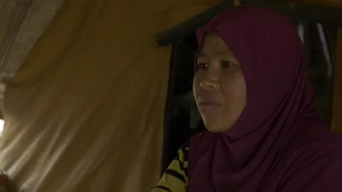 A Muslim family living in a tent shelter | Stock Video | Pond5
