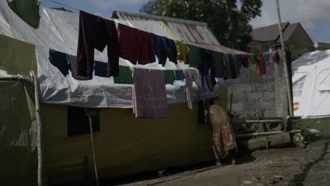 A Muslim family living in a tent shelter | Stock Video | Pond5