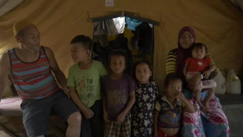 A Muslim family living in a tent shelter | Stock Video | Pond5