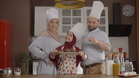 Muslim family proudly showing the cookie... | Stock Video | Pond5