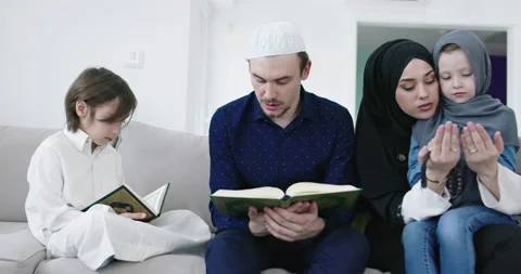 Muslim family reading Quran and praying ... | Stock Video | Pond5