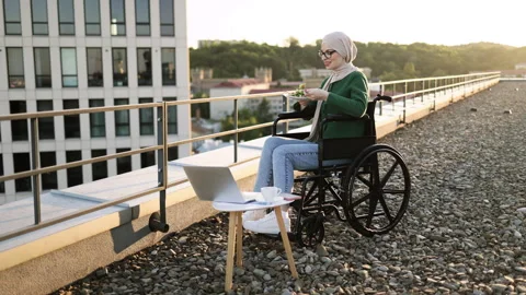 Muslim lady with disability eating food ... | Stock Video | Pond5