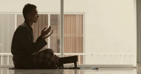 Muslim man praying to the GOD at home | Stock Video | Pond5