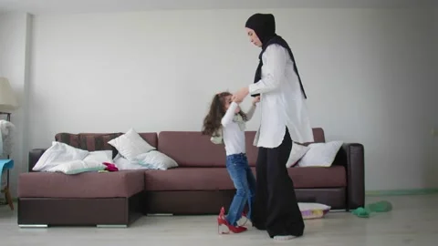 A Muslim mother in a hijab and her daugh... | Stock Video | Pond5