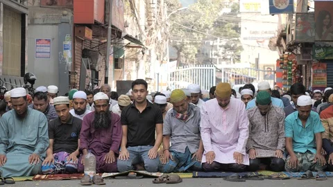 Muslim praying on street outside mosque,... | Stock Video | Pond5