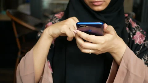 muslim women hand holding smart phone | Stock Video | Pond5