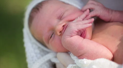 My mother cradles a newborn baby in her ... | Stock Video | Pond5