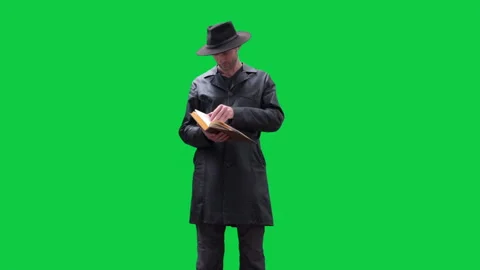 Mysterious Figure Reading Book - Green S... | Stock Video | Pond5