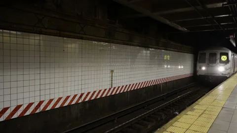 N Subway train arriving at station in Ne... | Stock Video | Pond5