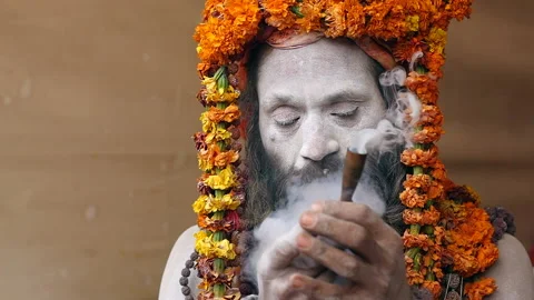 Naga Sadhu Smoking from Pipe at Kumbh Me... | Stock Video | Pond5