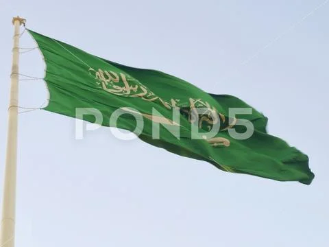 The national flag of Saudi Arabia kingdom, a green background with ...