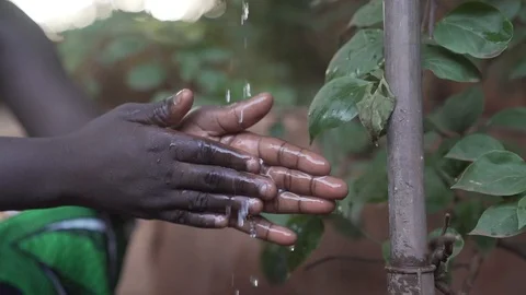 Native African Girl Washing Hands | Stock Video | Pond5