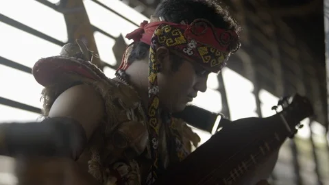 native dayak tribe's man playing sampe, ... | Stock Video | Pond5