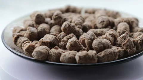 natural bran on a plate rotates in a cir... | Stock Video | Pond5