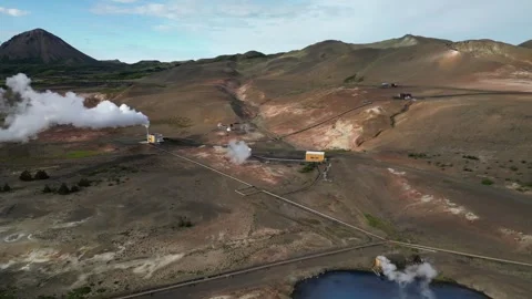 Natural hot spring factory spewing steam... | Stock Video | Pond5