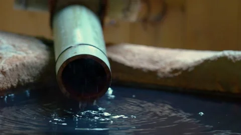 Natural hot spring water flows from bamb... | Stock Video | Pond5