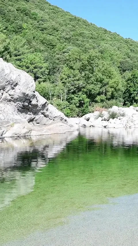 Natural pool in Corsica, pure emerald-gr... | Stock Video | Pond5