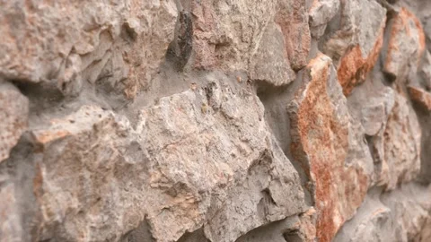 Natural stone wall with rough texture an... | Stock Video | Pond5