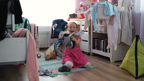 Naughty little girl making a mess in her... | Stock Video | Pond5