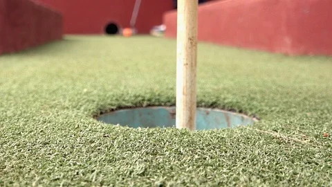 Near Miss at the Mini Golf as the Ball S... | Stock Video | Pond5
