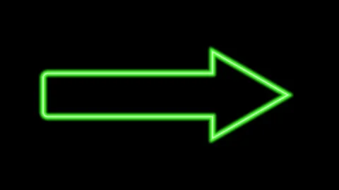 Neon green arrow sign on black backgroun... | Stock Video | Pond5