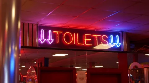 Neon toilets sign in night club strip ba... | Stock Video | Pond5