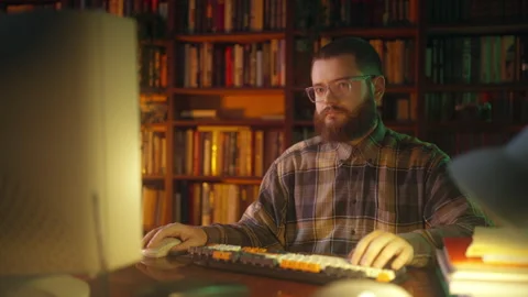 Nerdy guy working on computer in 90s off... | Stock Video | Pond5