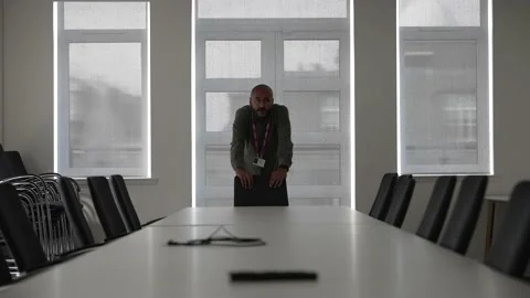 Nervous asian manager alone in empty mee... | Stock Video | Pond5