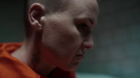 Nervous Female Inmate Sitting in Prison ... | Stock Video | Pond5