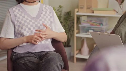 Nervous Teenage Girl Fidgeting Fingers a... | Stock Video | Pond5