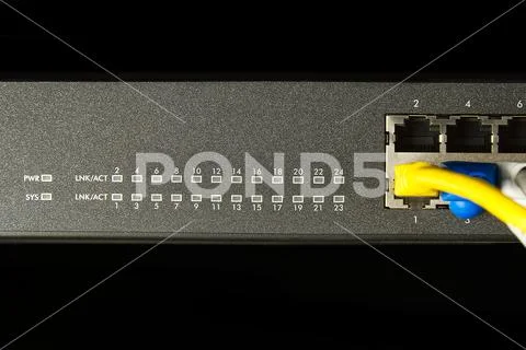 Network switch and ethernet cable in rack cabinet. Network connection ...