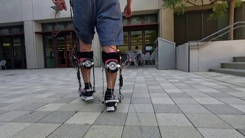New exoskeleton boot puts a spring in yo... | Stock Video | Pond5