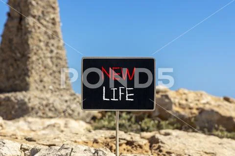 New life symbol. Concept words New life on wooden blocks on a beautiful ...