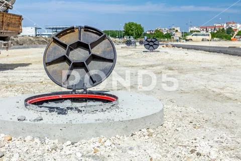 New manhole in compacted gravel ~ High Resolution #71076573