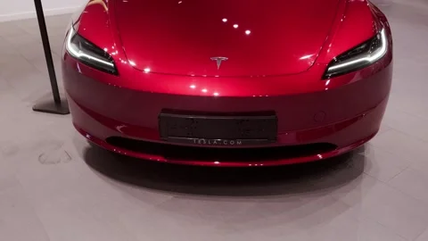 new red Tesla Model 3 electric car in sh... | Stock Video | Pond5