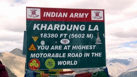 A new road sign claiming an elevation of... | Stock Video | Pond5