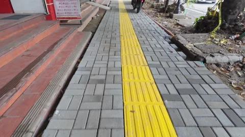 New yellow tactile paving blocks install... | Stock Video | Pond5