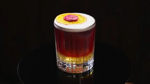 New york sour cocktail with orange wheel... | Stock Video | Pond5