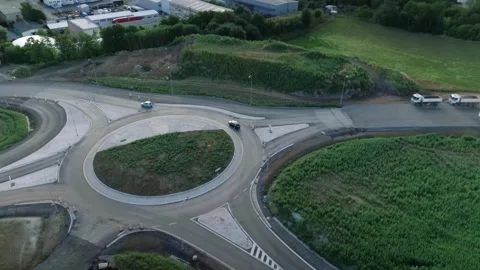 Newly built roundabout. Passing cars con... | Stock Video | Pond5