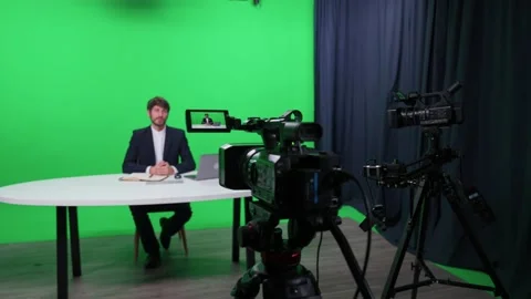 News anchor looks into the camera and ta... | Stock Video | Pond5