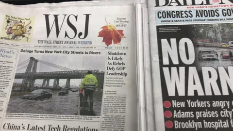 Newspaper Coverage of Heavy Flooding in ... | Stock Video | Pond5