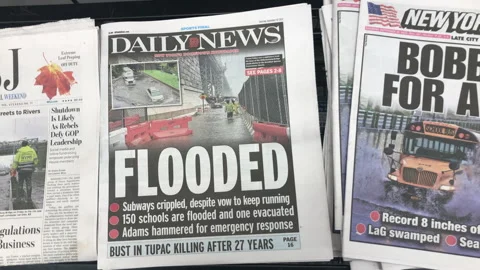 Newspaper Coverage of Heavy Flooding in ... | Stock Video | Pond5