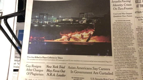Newspaper Coverage of Japan Airlines jet... | Stock Video | Pond5