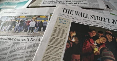 Newspaper Coverage of a mass shooting at... | Stock Video | Pond5