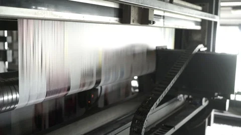 Newspaper strip on a printing machine. D... | Stock Video | Pond5