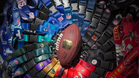 NFL ball spinning with all teams logos s... | Stock Video | Pond5