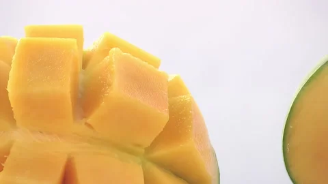 Nice mango half cut in cubes | Stock Video | Pond5