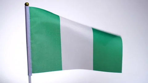 Nigerian flag on flagpole flying and wav... | Stock Video | Pond5