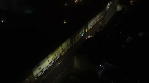 Night aerial shot of a car driving down ... | Stock Video | Pond5