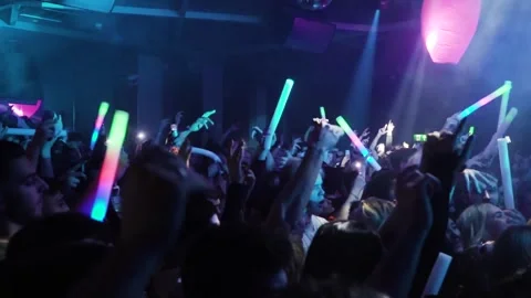 Night Club Crowd with Glow sticks | Stock Video | Pond5